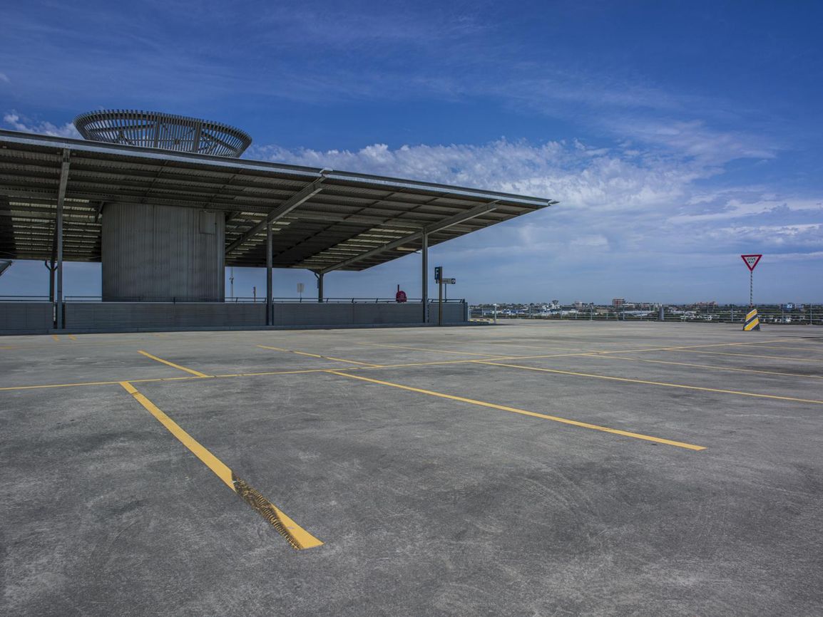 Cityscape of Parking Lot and Concrete Building