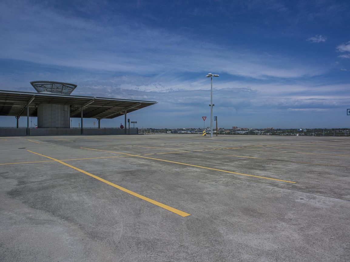 Cityscape of Parking Lot and Concrete Building
