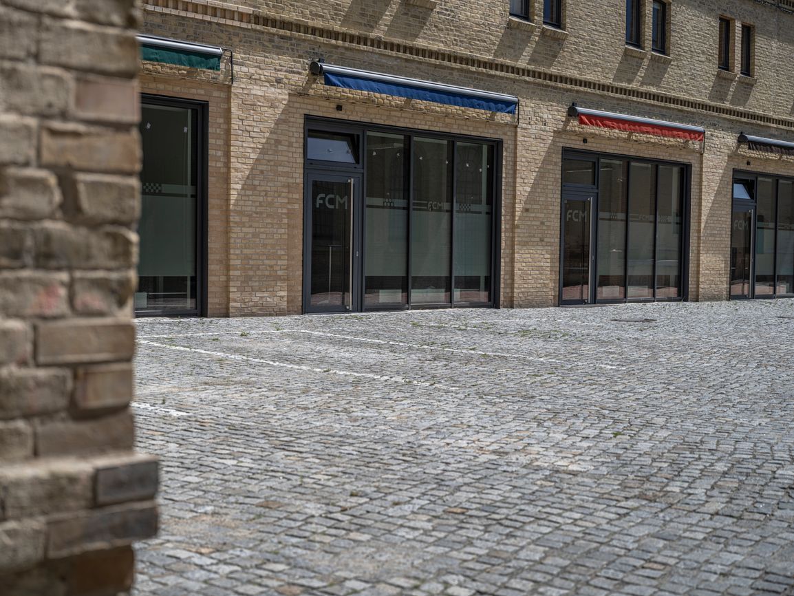 Cobblestone Courtyard with Warehouse Storage