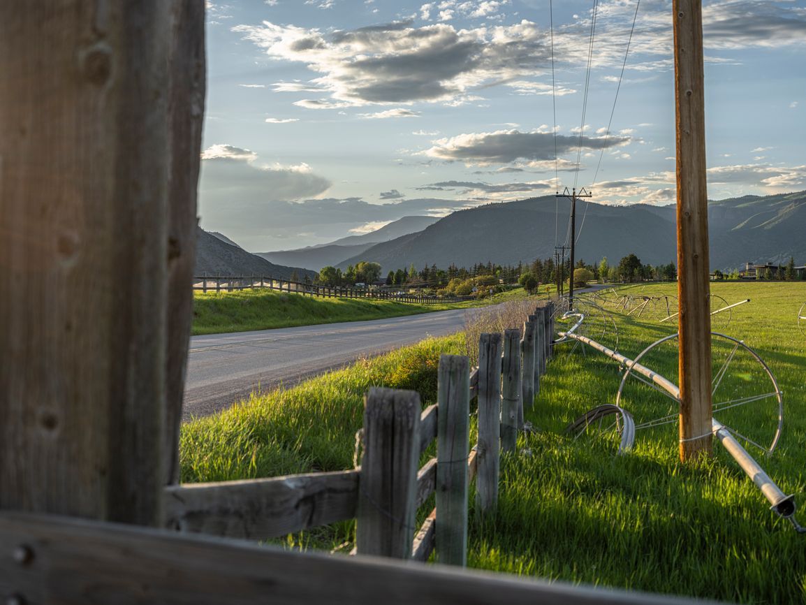 Rural Colorado at Dawn: Greenery and Mountainous Landscape