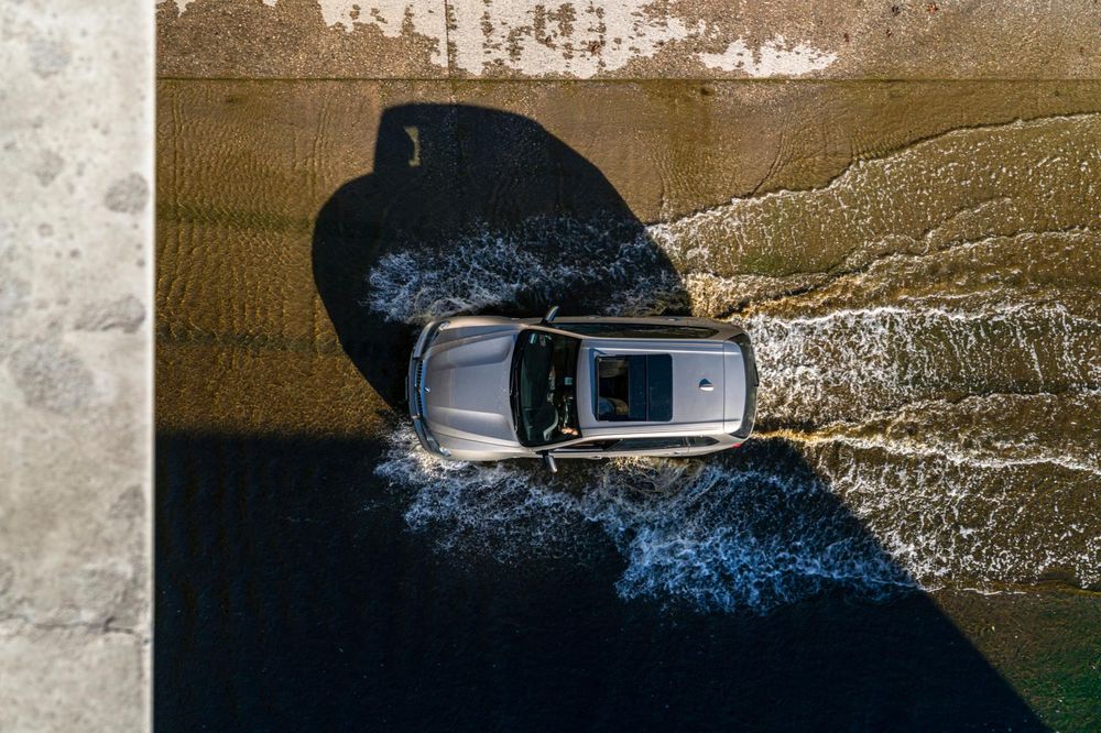 Aerial View of a Car Driving Through the Water in Los Angeles ...