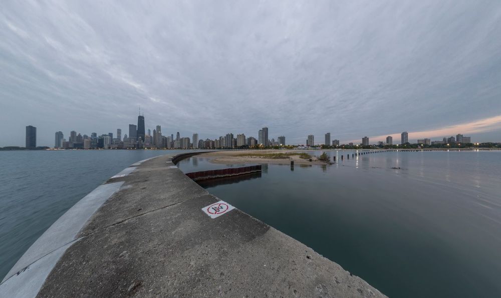 Coastal Pier in Chicago: A Stunning Skyline reflected on the Water ...