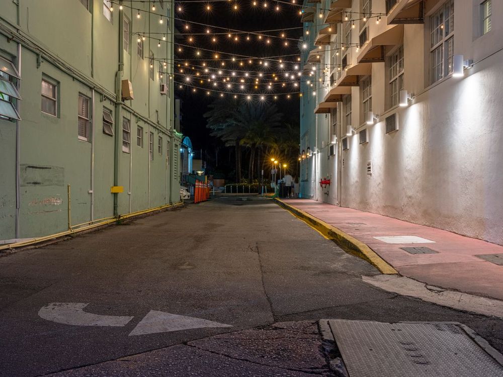 Empty City Alley in Miami with String Lights at Night