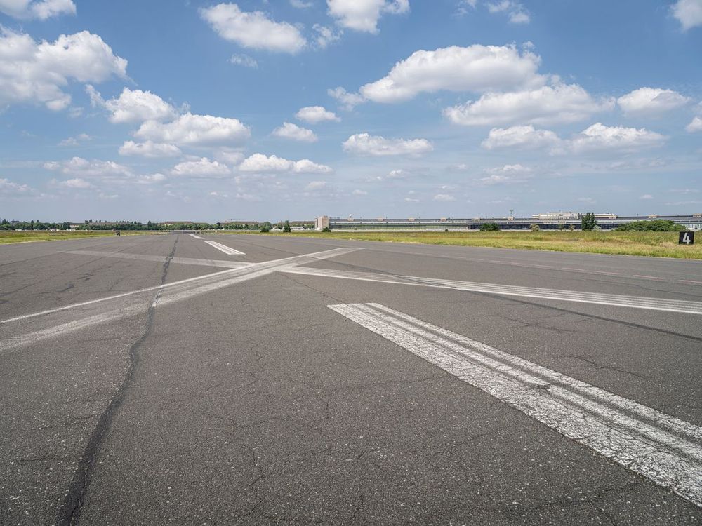 Empty Runway with Fluffy White Clouds Overhead - HDRi Maps and Backplates