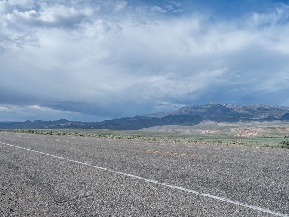 Utah Landscape: Asphalt Road with Majestic Mountains
