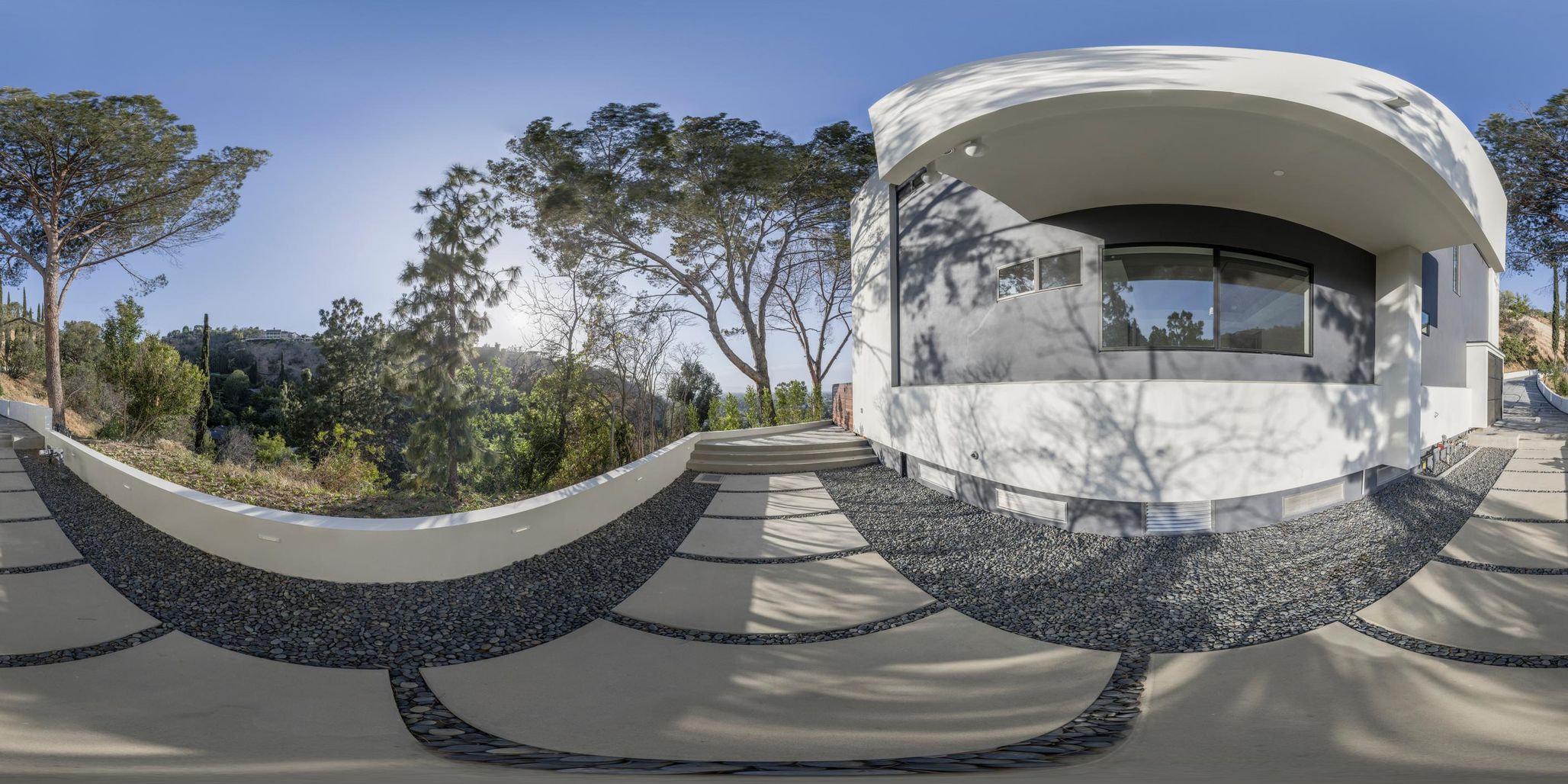 California Landscape: A Circular Building Overlooking Trees and Shadows ...