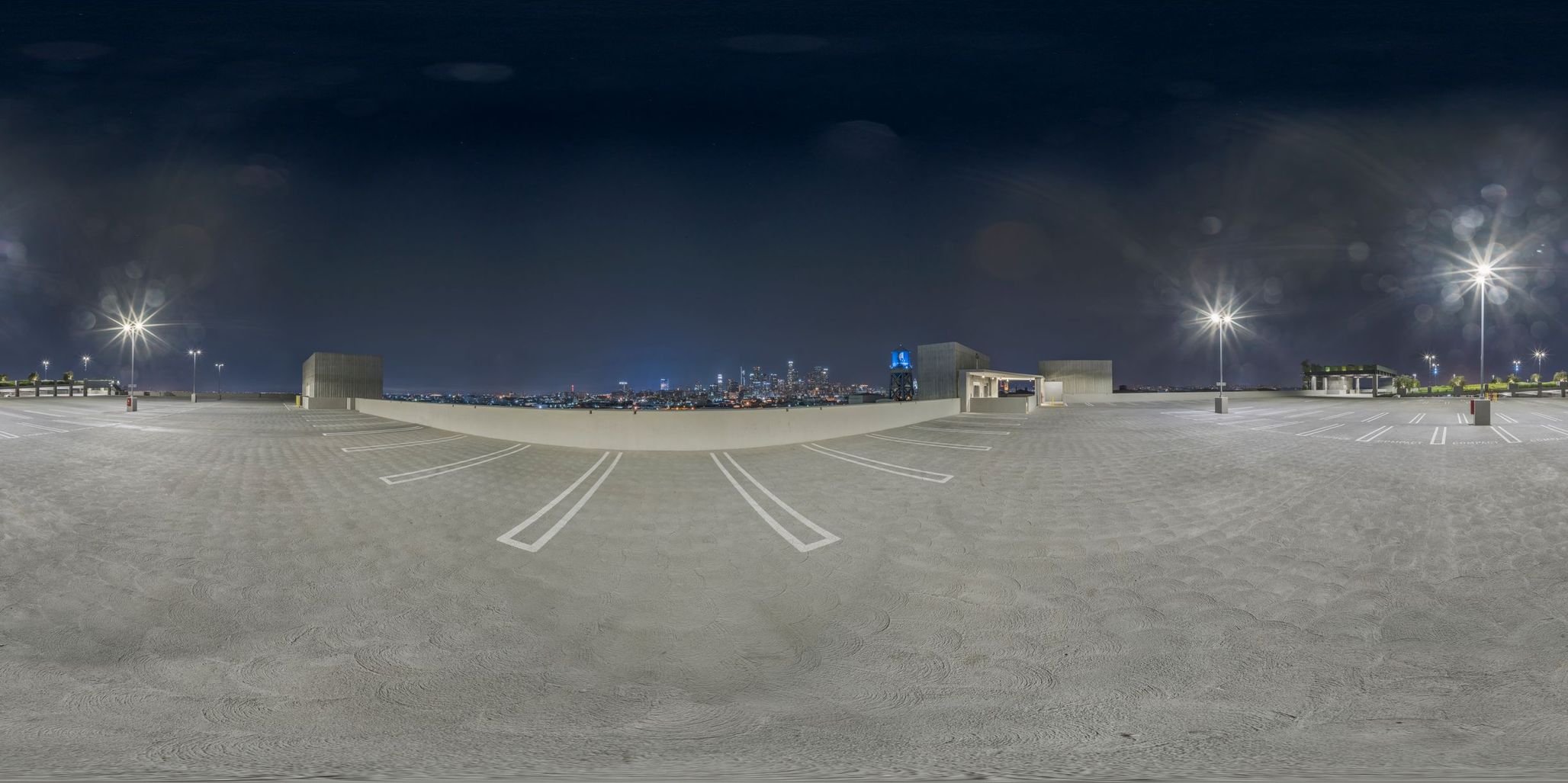 Skateboarder in Empty Parking Lot at Night with Cityscape - HDRi Maps ...