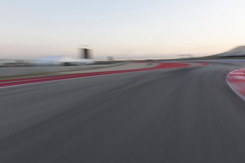 Red Race Car Speeds Down a Winding Road - HDRi Maps and Backplates