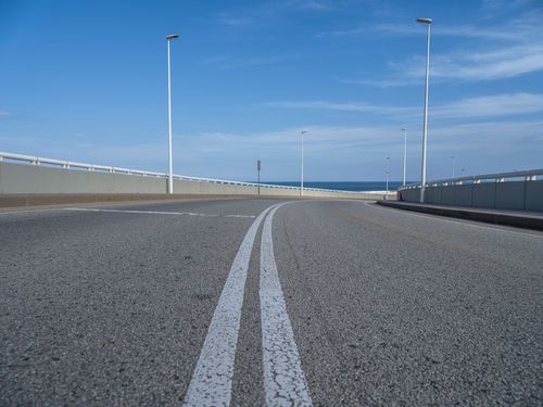 Straight Road in Barcelona: Leading to a Modern Bridge