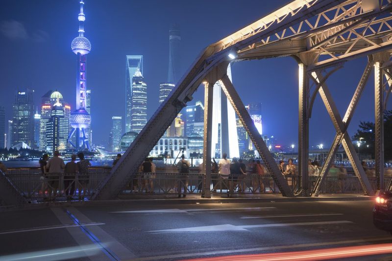 Cityscape of Shanghai at Night with Stunning Architecture and Bridge ...