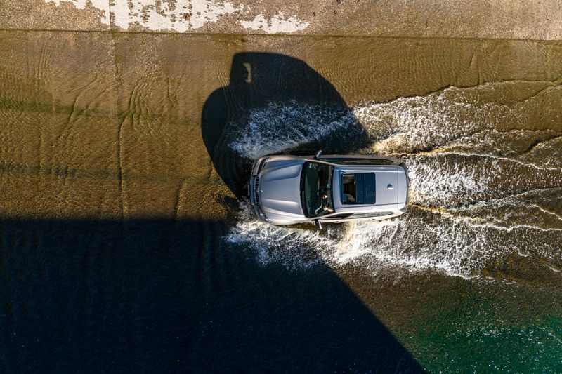Aerial View of a Car Driving Through the Water in Los Angeles ...