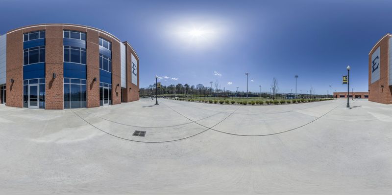 Aerial View of a Football Stadium with Clear Sky HDRi Maps and Backplates