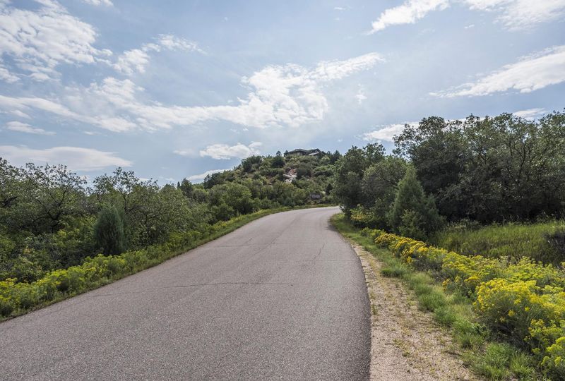 Asphalt Road through a Lush Landscape HDRi Maps and Backplates