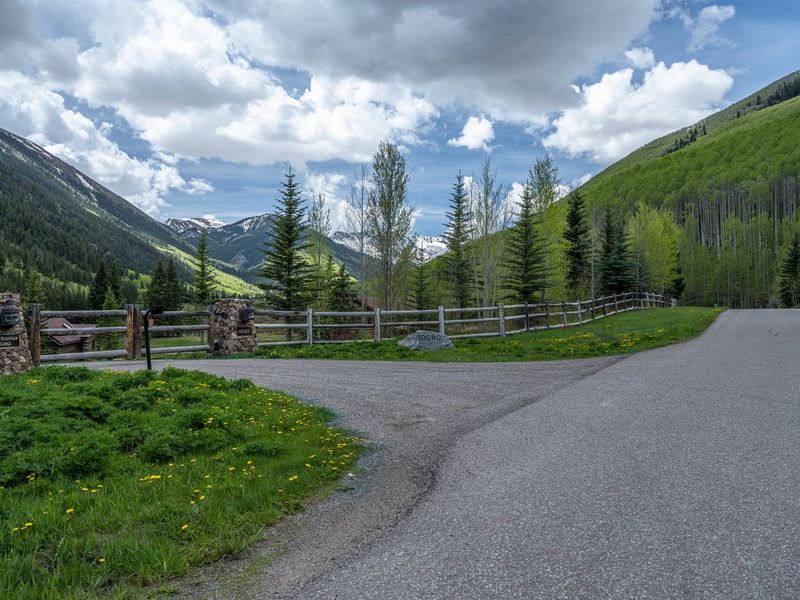 Asphalt Roads in Colorado: Nature Under a Cloudy Sky