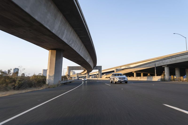 Car Driving on a Concrete Bridge Overpass with Highway Traffic HDRi ...