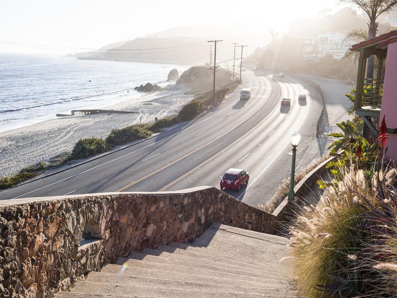 Car passing on a beachside road in Los Angeles, California, USA HDRi ...