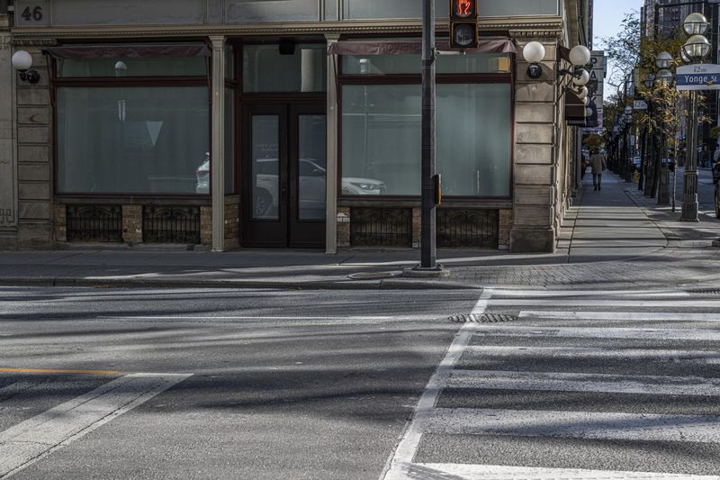 City Life in Toronto: Daytime Traffic, Lights, and Windows