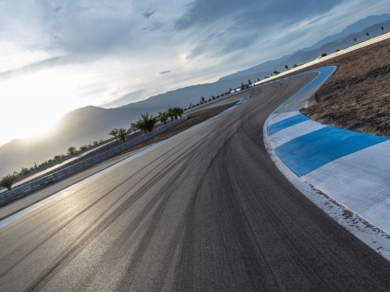 Curved Race Track with Sunshine Visible HDRi Maps and Backplates