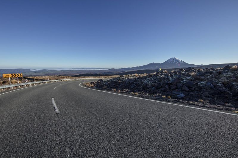 Curving Highway with Mountain and Blue Sky HDRi Maps and Backplates