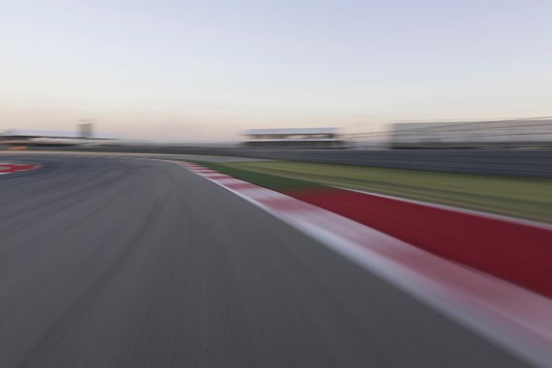 Dawn Over the Race Track: Clear Sky and Racing HDRi Maps and Backplates