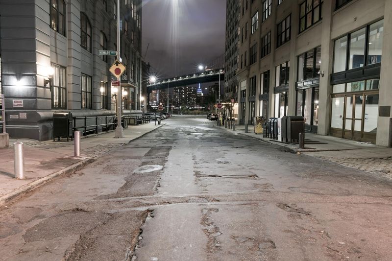 Empty City Street at Night in Urban Setting with Buildings and Street ...