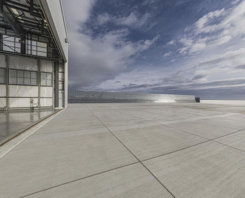Empty Commercial Airplane Tarmac by the Ocean with Dramatic Clouds ...