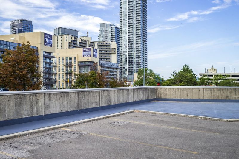 Empty Parking Lot in a City with Tall Buildings and Blue Sky HDRi Maps ...