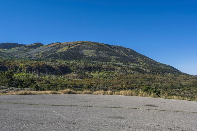 Empty parking lot with mountains in the background HDRi Maps and Backplates
