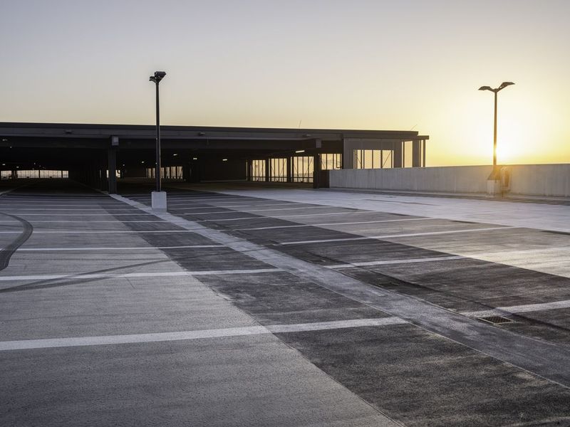 Empty Parking Lot at Sunrise with Sun Reflection HDRi Maps and Backplates