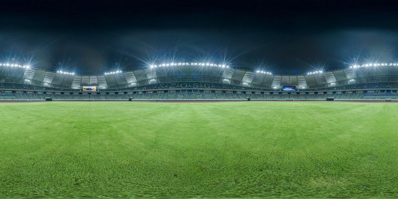 Empty Stadium in China: A Green Baseball Field Illuminated by Lights ...