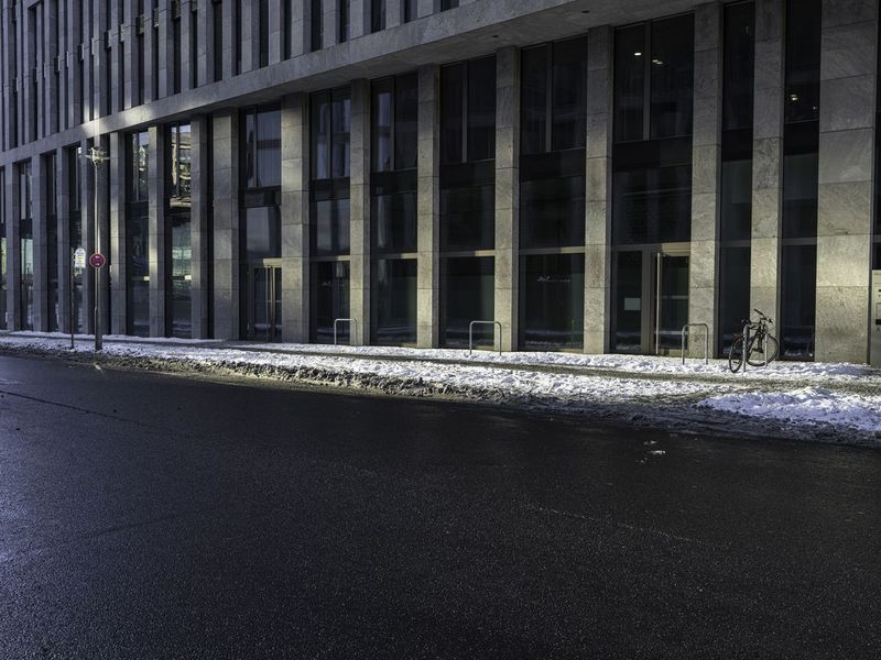 Empty Street Covered in Ice in Front of Office Building