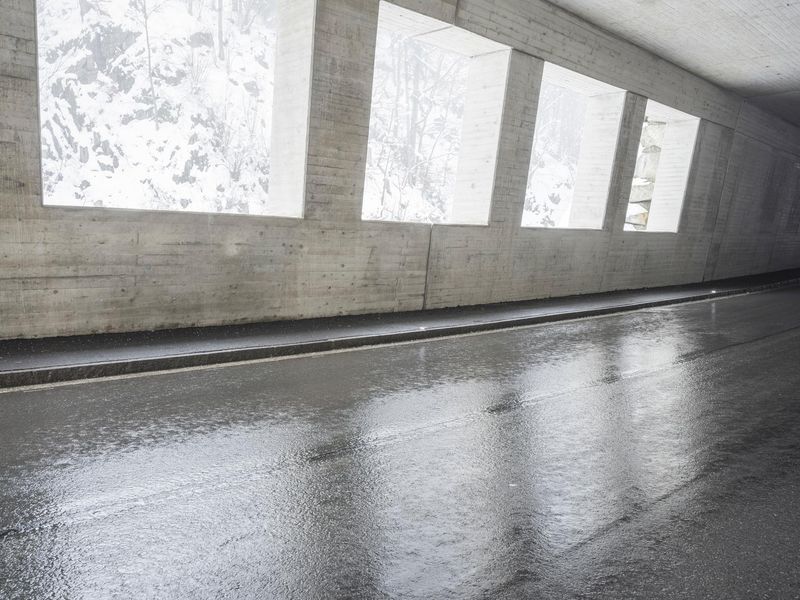 Empty Urban Road with Rain Covered Bridge, Windows, and Concrete Walls ...