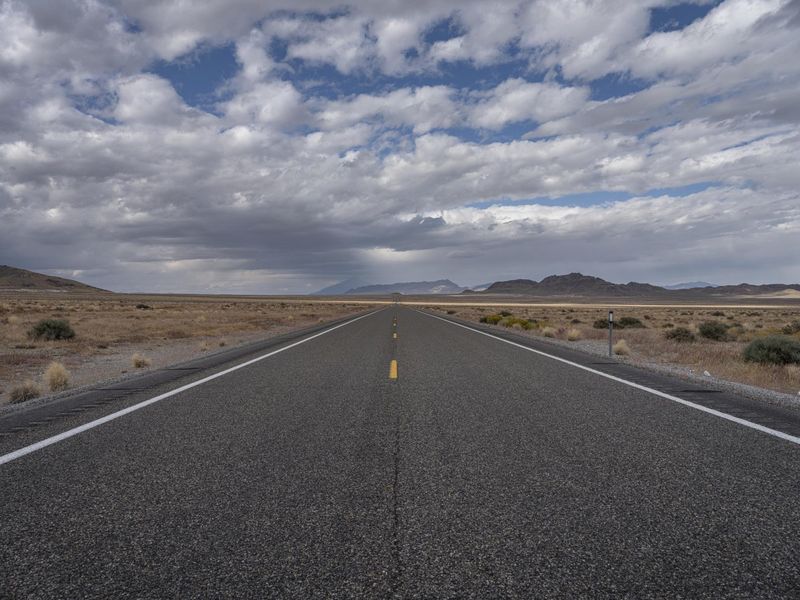 Endless Road Through Utah Highland Landscape with Mountains and Cloudy ...
