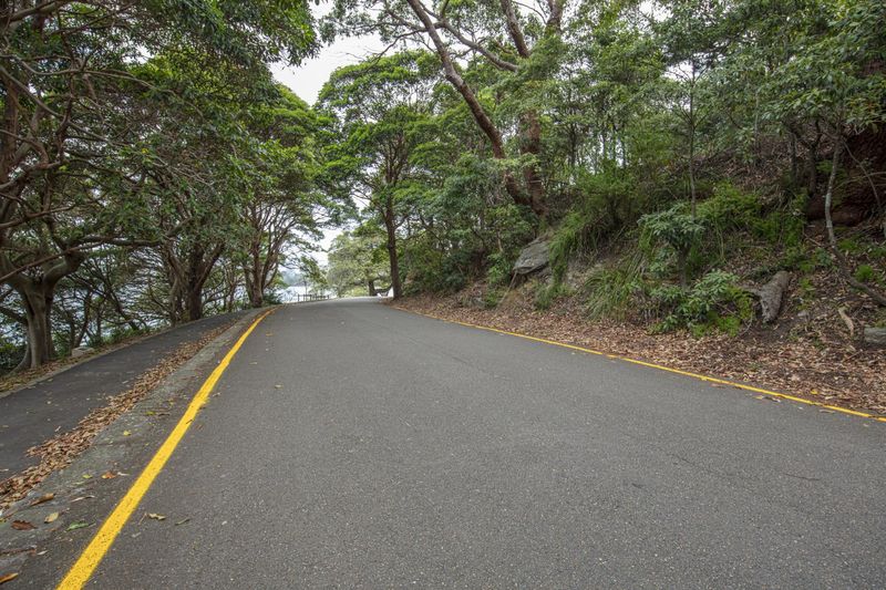 Gloomy Landscape with Road, Cliff, and Water HDRi Maps and Backplates