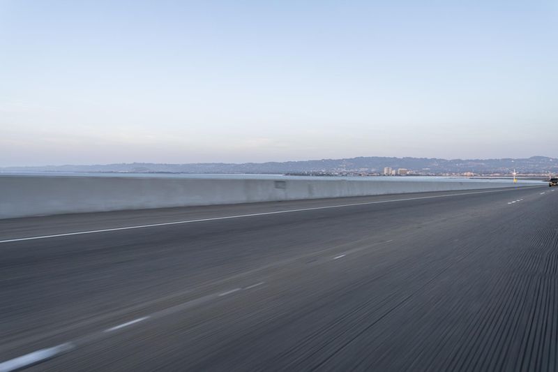Grey Highway in Motion Blur with Clear Skies HDRi Maps and Backplates