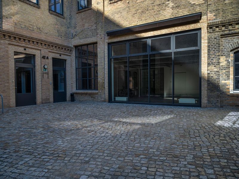 Historic Warehouse in Berlin: Cobblestone Courtyard and Classic ...