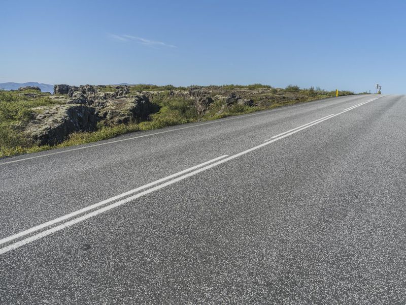 Iceland Road: Asphalt Cutting Through Grassy Plain HDRi Maps and Backplates