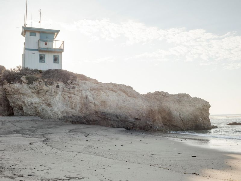 Lighthouse on a Rocky Cliff at the Beach HDRi Maps and Backplates