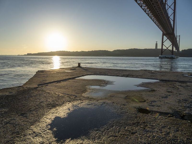 Lisbon Harbor at Dawn with Clear Sky and Sun Burst HDRi Maps and Backplates