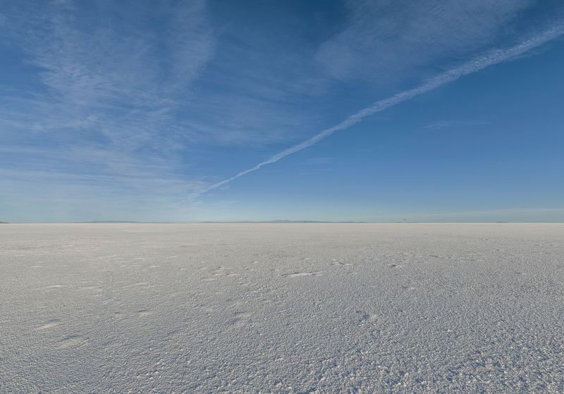 A Lone Person Walking on Snow Covered Ground at Salt Lake, Utah, USA ...