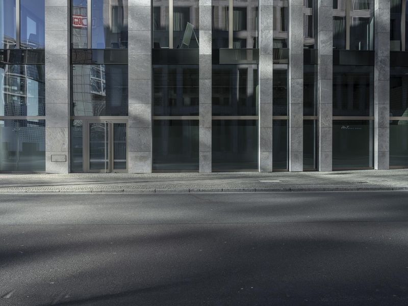 Man Crossing Street in Urban Area with Glass Building in Berlin ...