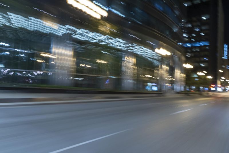 Nighttime Cityscape in Chicago with Cars Driving on Highway