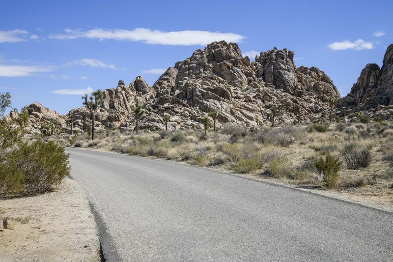 Paved Highway Through Barren Desert with Rock Wall HDRi Maps and Backplates