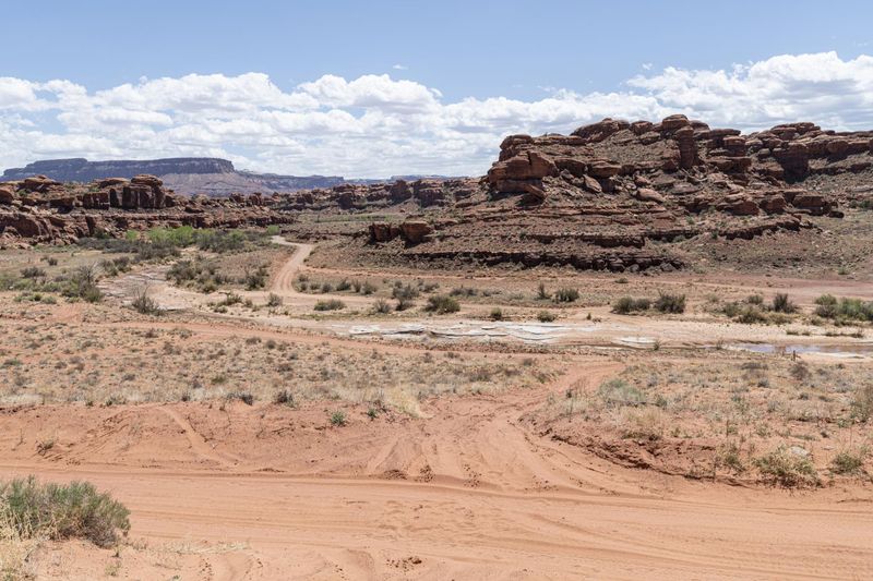 Scenic Red Dirt Road Through Sandy Landscape with Rocks and Hills HDRi ...