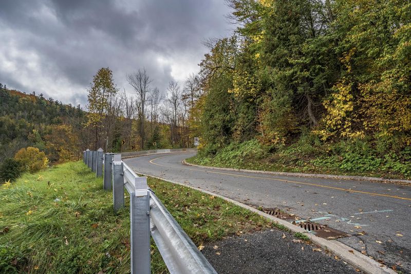 Scenic Road with Autumn Trees and Warning Sign HDRi Maps and Backplates