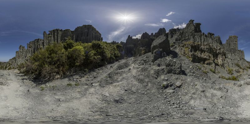 A Steep Cliff Next to a Body of Water in a Mountain Landscape HDRi Maps ...