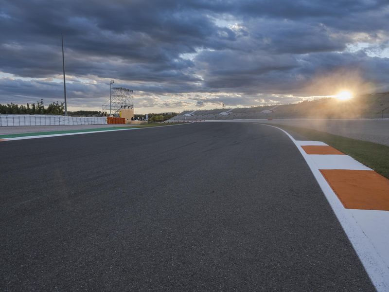 Sunlit Race Track on Valencia Straight Road with Dramatic Mountains ...