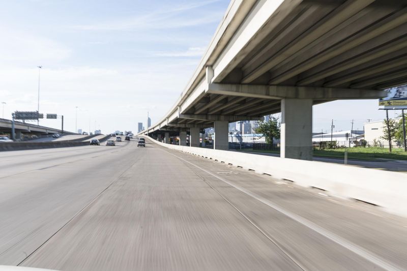 Urban city road with asphalt and concrete bridge in Houston, Texas, USA ...