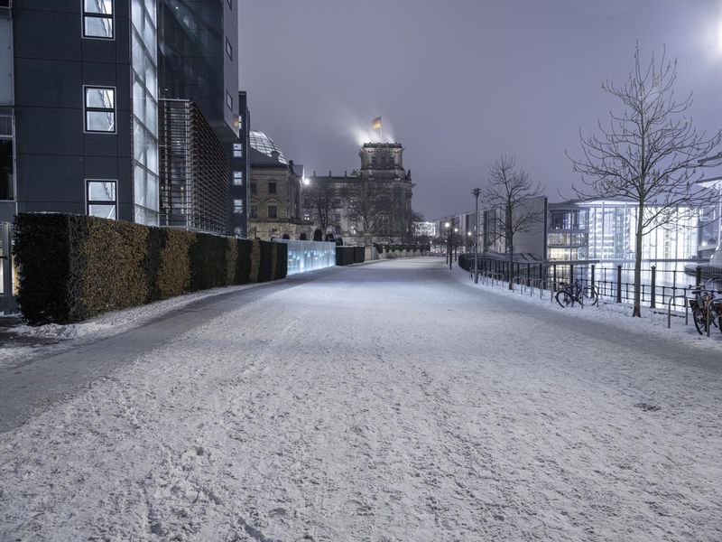 Winter Road with Building and Sunlight